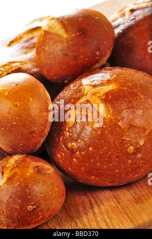Bakery, crusty loaves of bread and buns. Assortment of baked bread ...