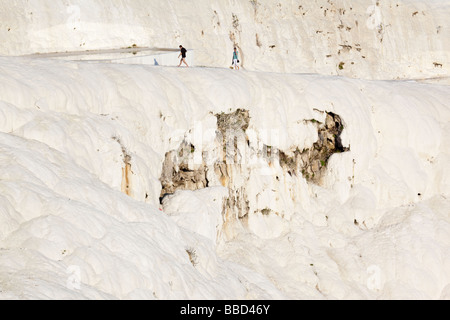 Tourists at the white mineral cliffs at Pamukkale in Turkey Stock Photo ...