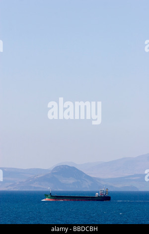 Container ship passing the Isle of Arran in the forth of clyde on the ...