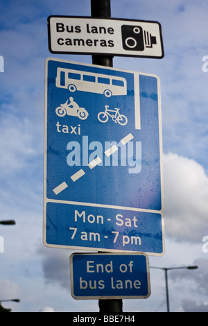 A blue sign indicating a bus lane Stock Photo - Alamy