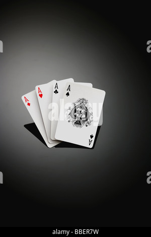 four aces playing cards suits on white background Stock Photo - Alamy