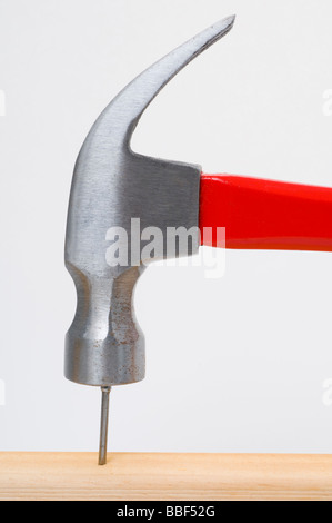 claw hammer with nails and timber on table Stock Photo - Alamy