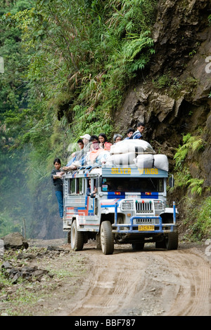 Fully loaded local bus in Libongo, deep in the jungle of Cameroon Stock ...
