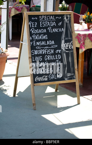 Bilingual menu board, sign in two languages, English and Spanish ...