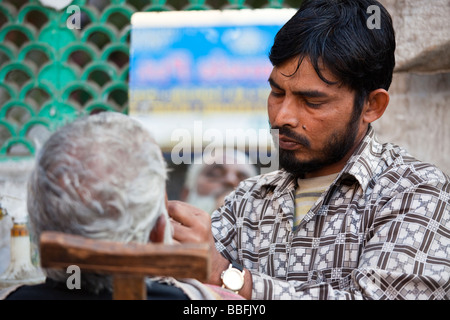 Barber Trimming a Muslim Man s Beard in Delhi India Stock Photo - Alamy