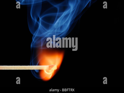 Lit match, flame, blue smoke Stock Photo - Alamy