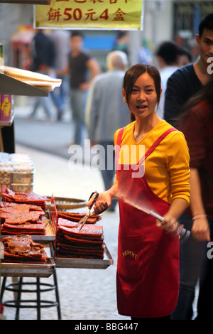 Street Hawker Selling Sheets Of Spiced Meat Stock Photo - Alamy