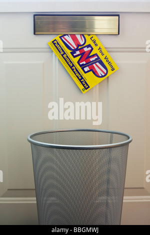 Election leaflets coming through letterbox with a bin below Stock Photo ...