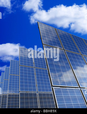 Solar panels on blue sky background Stock Photo - Alamy