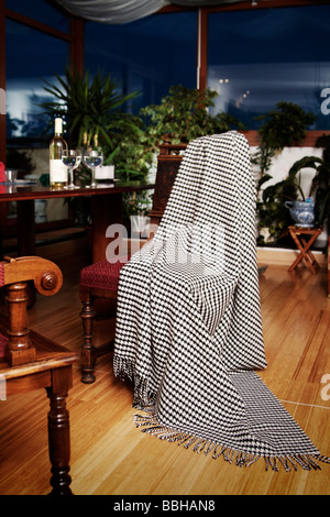 Throw draped over an antique chair Stock Photo - Alamy