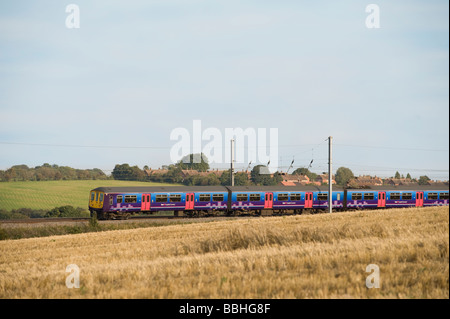 Passenger train class 319 in First Capital Connect livery speeding ...