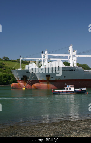 large cargo ships laid up in a deep creek on the river fal near truro ...