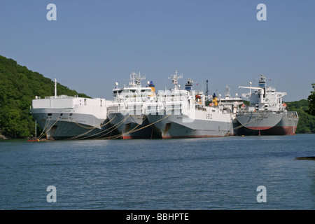 large cargo ships laid up in a deep creek on the river fal near truro ...