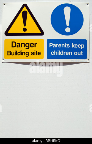 Warning notices outside building site Cotswolds UK Stock Photo - Alamy