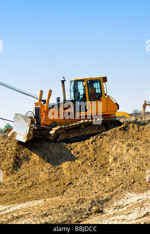 yellow bulldozer a moving land shovel Stock Photo - Alamy