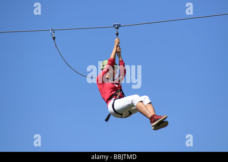 Slide down the wire at an adevnture playground Stock Photo - Alamy