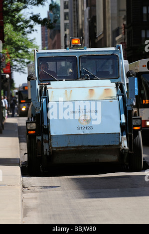 Mechanical road sweeper machine sweeping the gutters of Sate Street ...