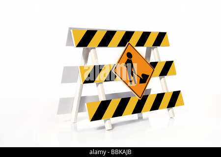 Under construction warning sign with yellow and black stripes painted ...