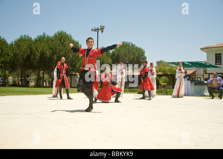 Turkish men and women wearing traditional clothes performing Anatolian ...