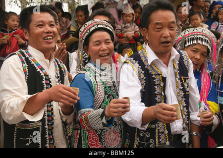 Hani Akha women and men singing a toast at the Long Table Festival in ...