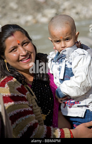 Mundan ritual head-shave for a boy of poor parents in a village temple ...