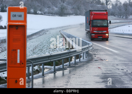 Emergency telephone on the motorway in front of the scene of an ...