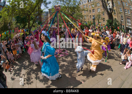 Donna Maria's Maypole dancers go around the maypole in brightly colored ...