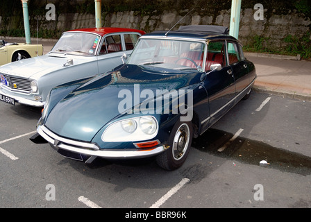 A beautiful classic blue Citroen DS with a white roof driving through a ...