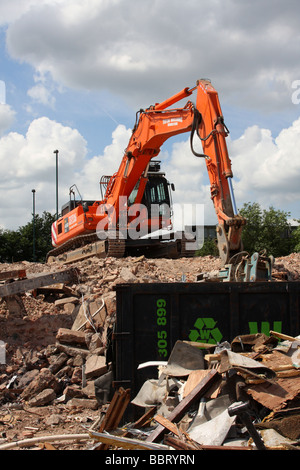 An earthmover on a demolition site in a U.K. city Stock Photo - Alamy