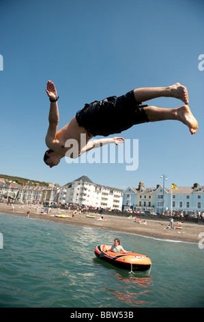 Man diving at a seaside resort Stock Photo - Alamy
