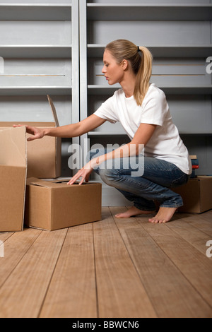 young woman and cartons, removal Stock Photo - Alamy