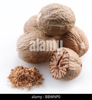 Nutmeg isolated. Whole nut and grated nutmeg powder, top view, over ...