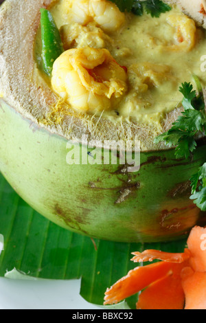 Dab chingri Malai Curry is made of prawns roasted inside a tender ...