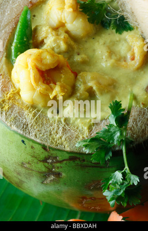 Dab chingri Malai Curry is made of prawns roasted inside a tender ...