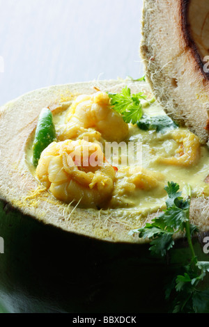 Dab chingri Malai Curry is made of prawns roasted inside a tender ...