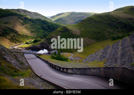 Looking down the concrete slipway on the dam at the end of the Llyn ...
