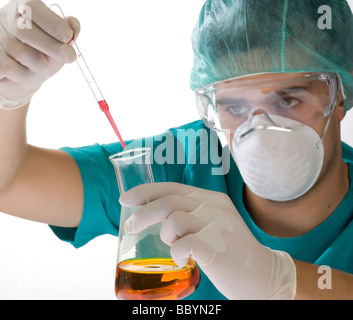 Scientist taking a probe in a labor scene with testtubes and beaker ...