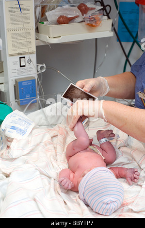 Newborn hispanic boy immediately after delivery via ceserean (c-section ...