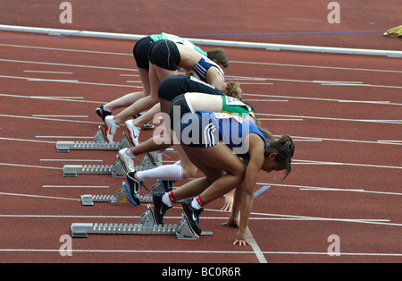 Female sprinters in the starting blocks of the HS Girl's 55m at the ...