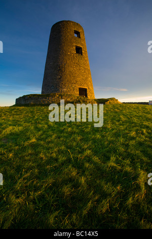 The rising sun spotlights the old mill in Windmill Field, located ...
