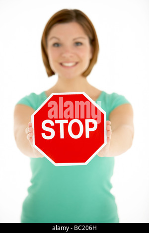 Woman with stop road sign, traffic rules and caution in portrait with ...