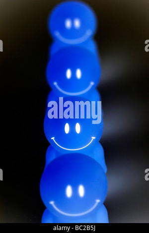 Closeup shot of small toy figures of bicycle riders on snails on an ...