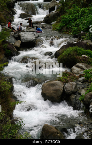 Girls washing clothes in a river Philippines Stock Photo - Alamy