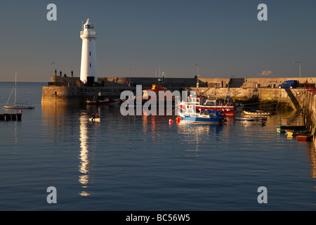 Donaghadee lighthouse harbour quay and boats in County Down harbour ...