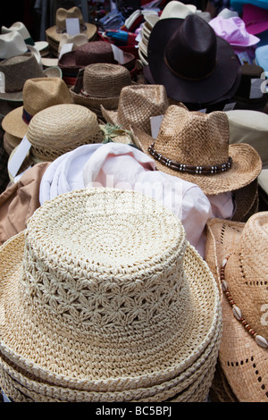A selection of straw sun hats for sale on a typical French market ...