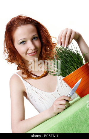 Portrait of a woman holding chives Stock Photo - Alamy