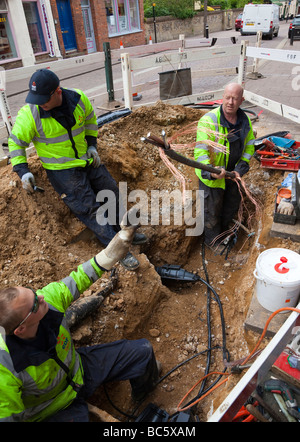 EDF workers repairing an electrical cable in the ground Stock Photo - Alamy