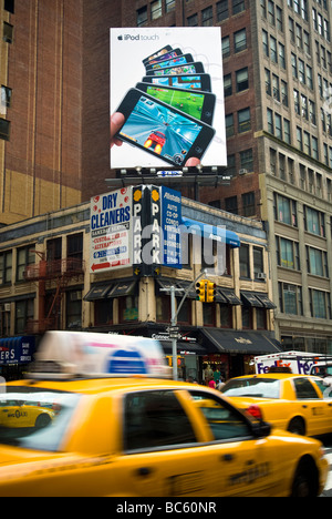 Advertising for the Apple Inc iPod on a billboard in the Chelsea ...
