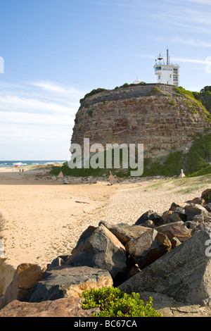 Nobbys Head and Beach with Light House and Ship Leaving Harbour Stock ...