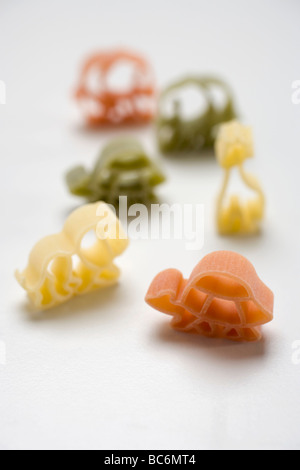 Coloured animal-shaped pasta in a row Stock Photo - Alamy